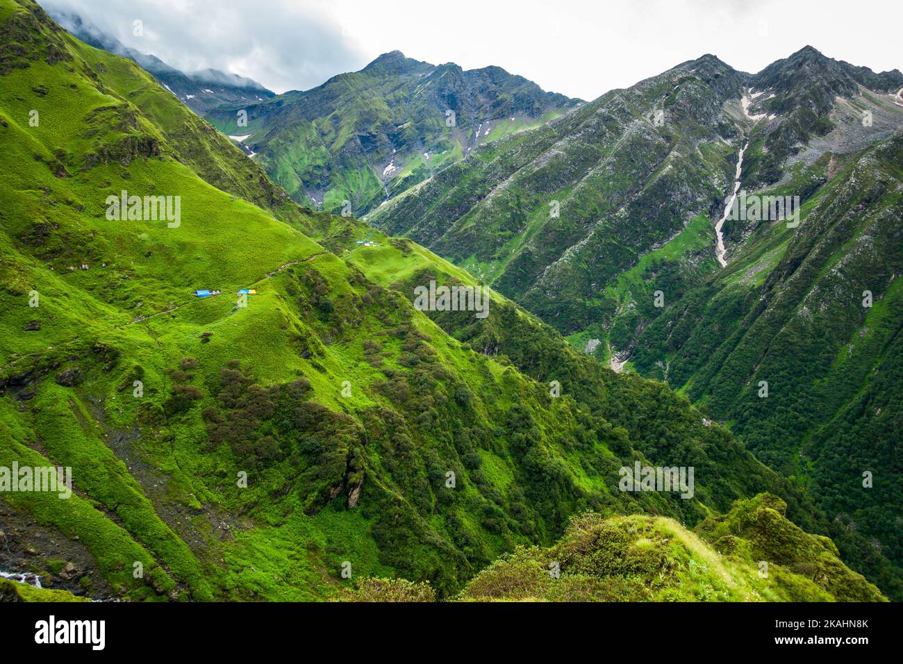 Beautiful mountains peaks and waterfalls in the background. Shrikhand ...