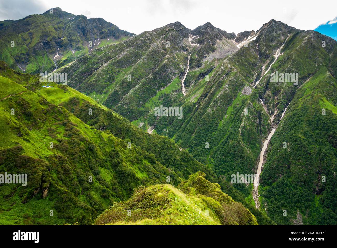 Beautiful mountains peaks and waterfalls in the background. Shrikhand Mahadev Kailash Himalaya ...