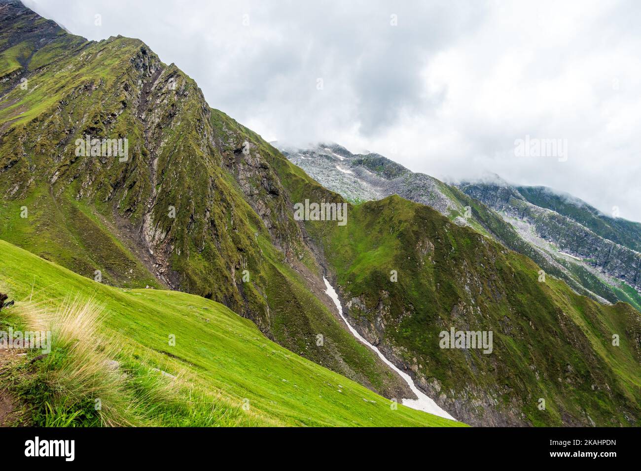 Beautiful mountains peaks and waterfalls in the background. Shrikhand ...