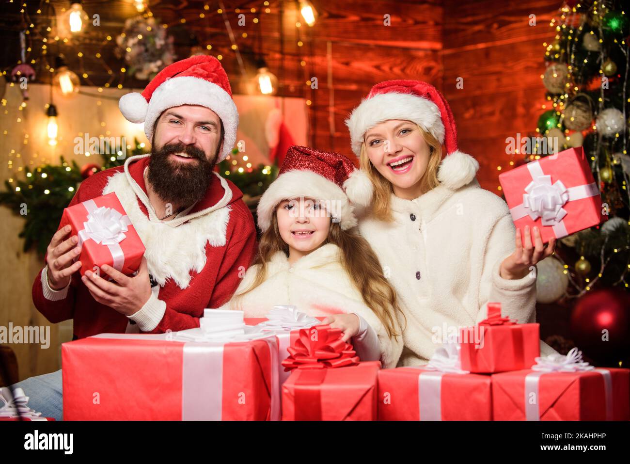 Love and kindness. Father Santa claus costume with family celebrating ...