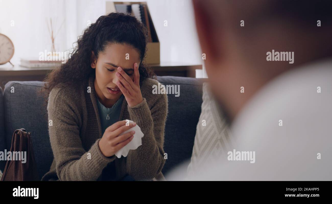 Woman, sad or crying on sofa by psychologist employee or healthcare ...