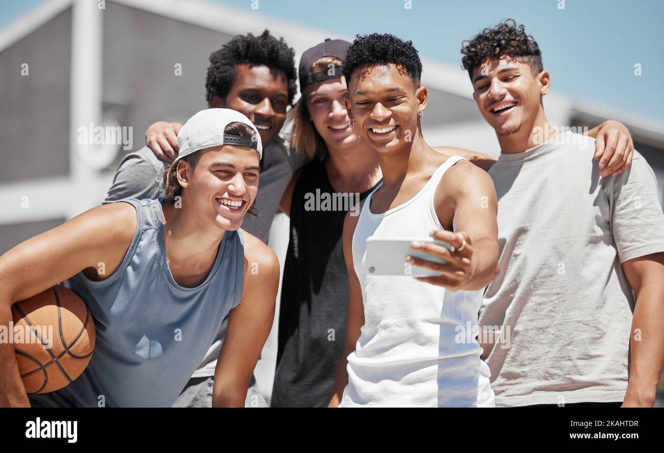 Basketball, phone and smile for team selfie in sports, exercise or ...