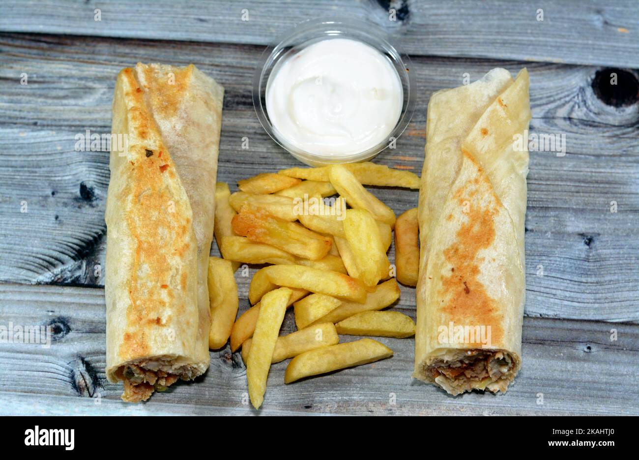 Syrian recipe cuisine background, chicken shawerma or shawarma tortilla ...