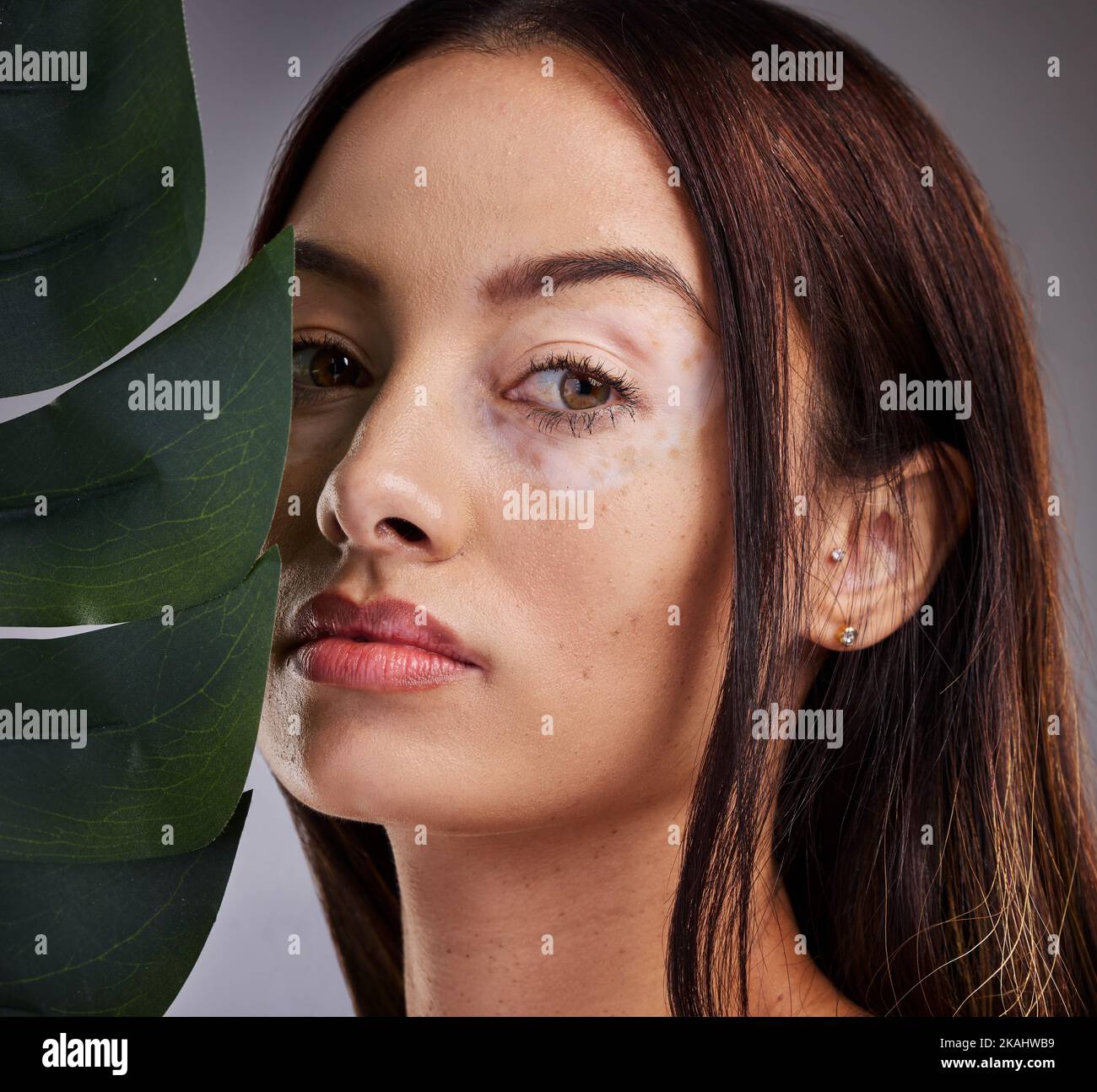 Beauty, leaf and woman with vitiligo in studio for wellness, skincare ...