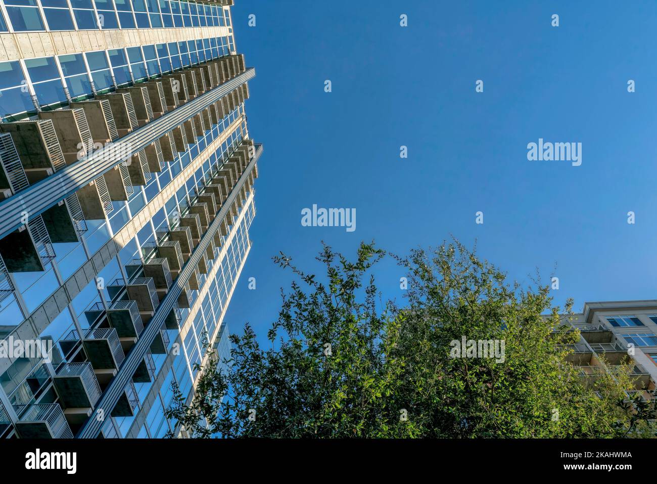 Flats and apartments with balconies and reflective glass windows at the ...