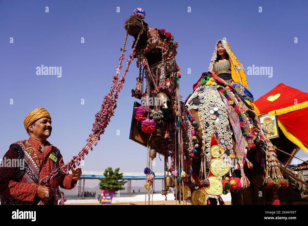 Famous camel decorator Ashok Tak entertains foreign tourists with his ...