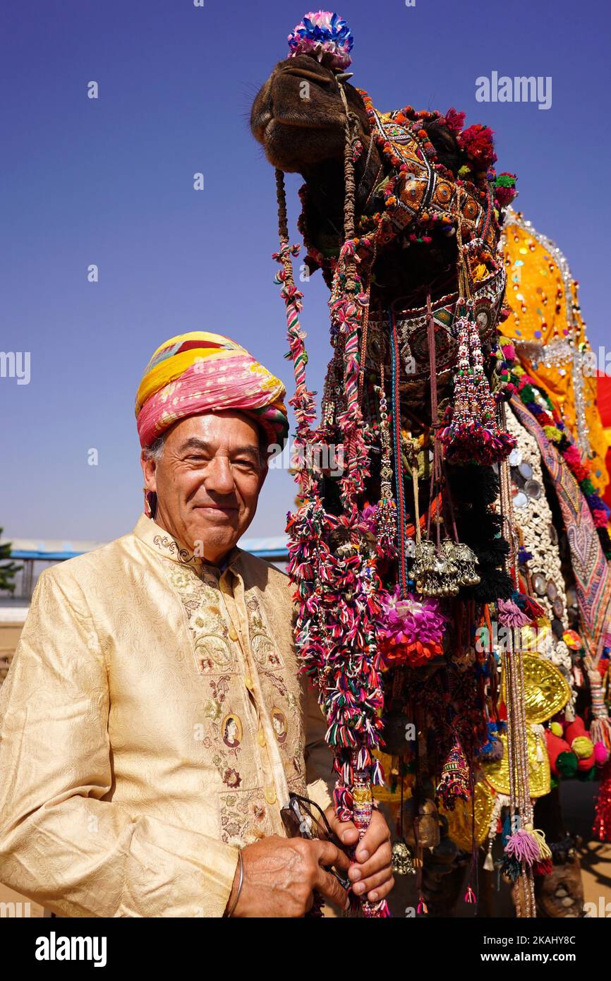 Famous camel decorator Ashok Tak entertains foreign tourists with his ...