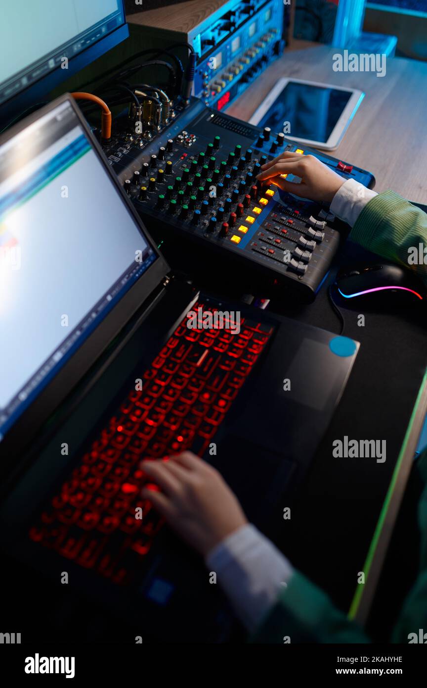 Closeup audio engineer hand mixing sound Stock Photo - Alamy