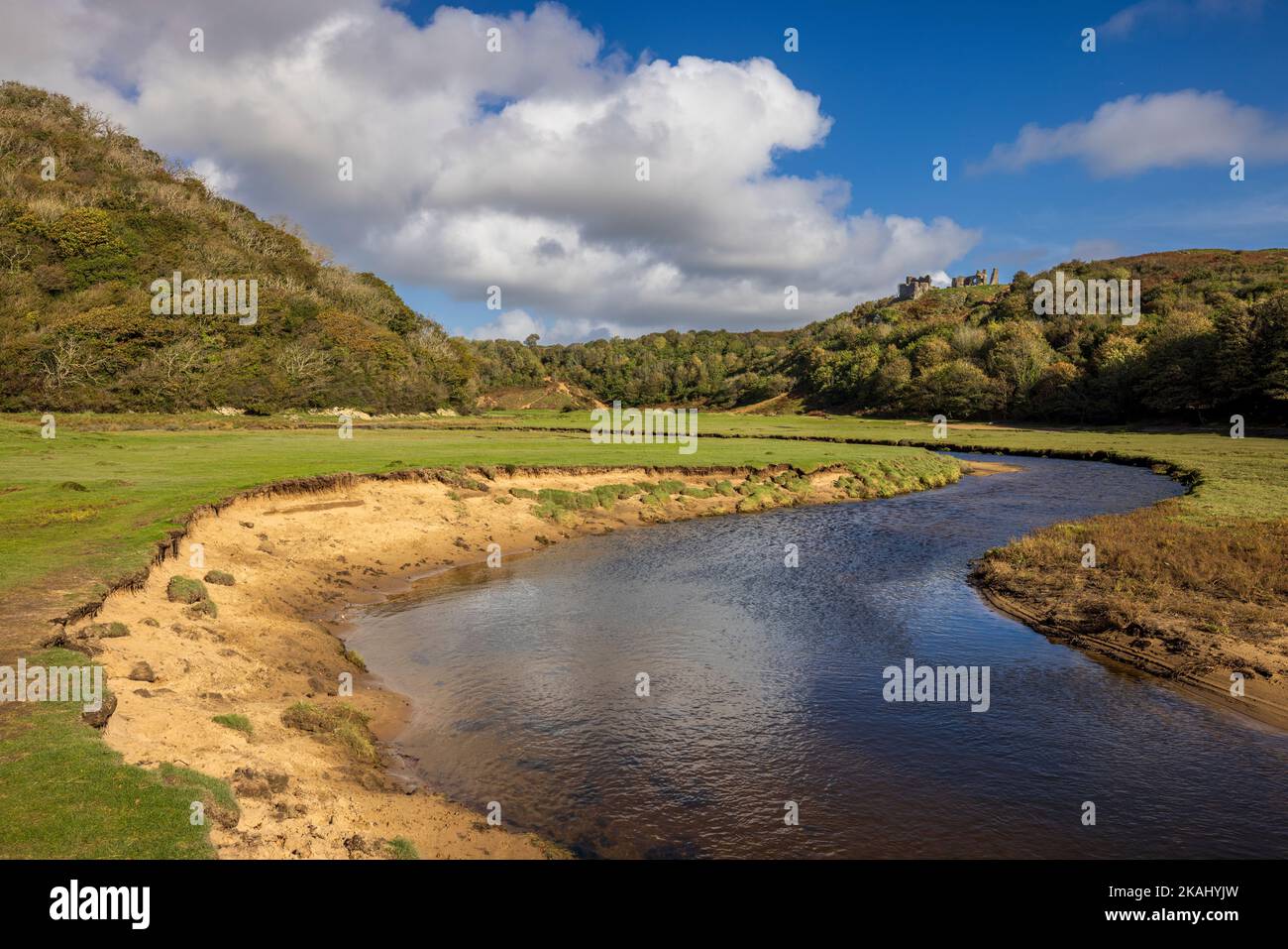 Pennard Pill flowing in to Three Cliffs Bay overlooked by Pennard ...