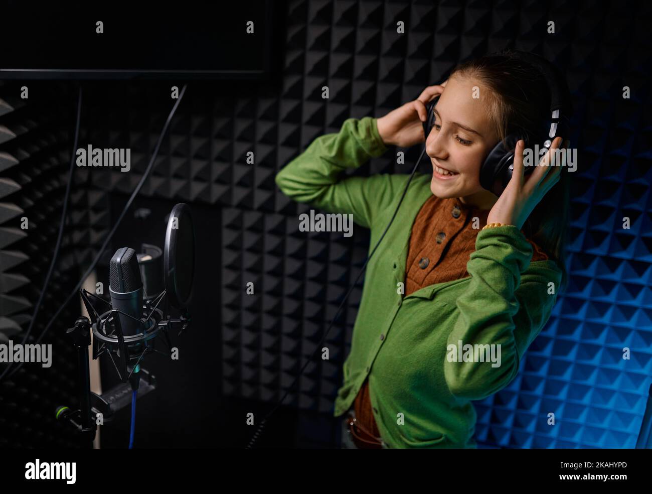 Young teenager girl singer at record studio Stock Photo - Alamy