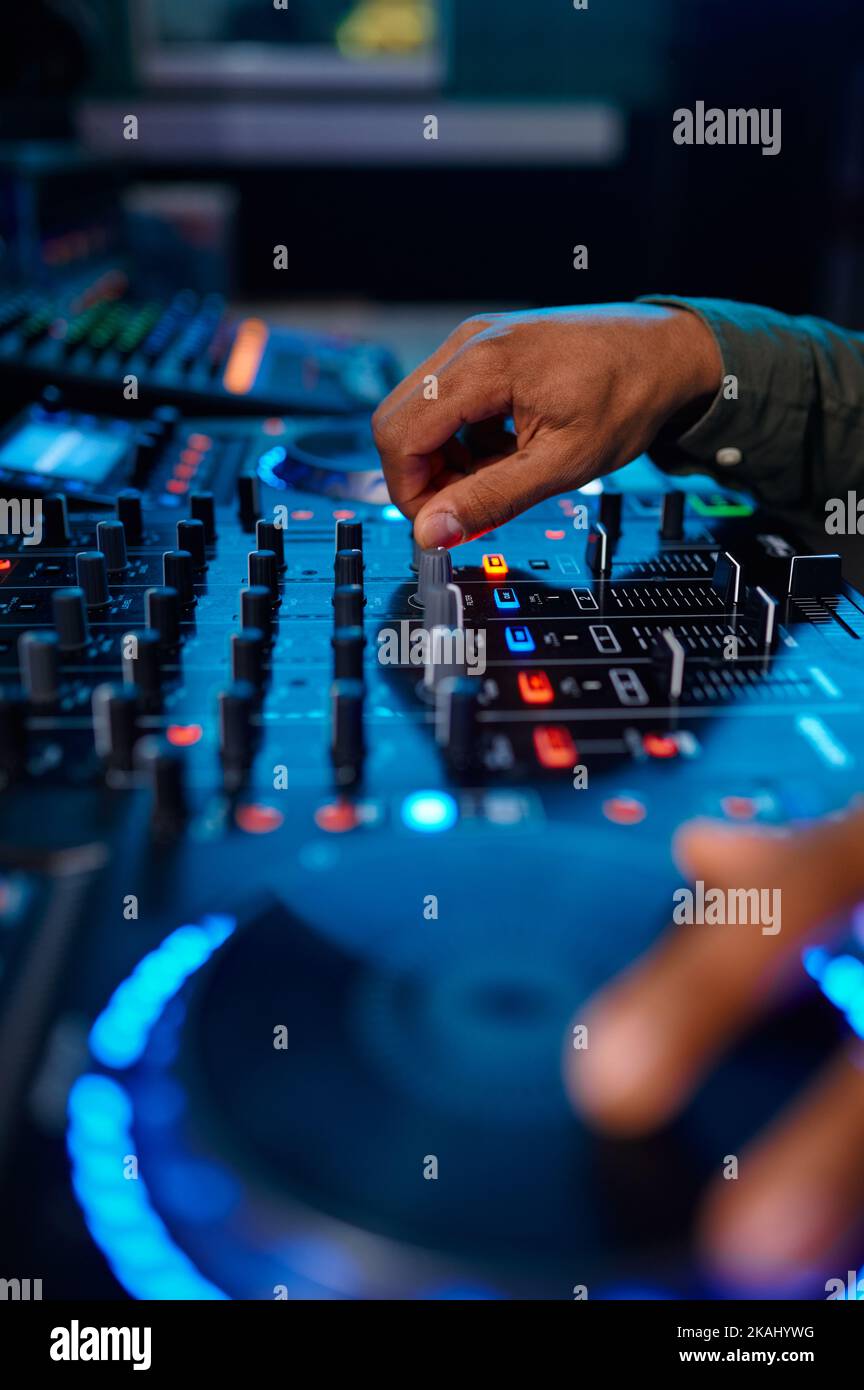 Closeup male hand on sound mixer console Stock Photo - Alamy