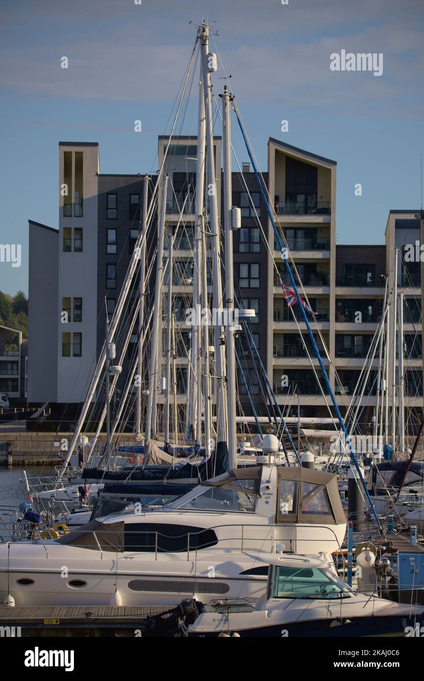 A vertical shot of row of empty docked boats at Chatham Harbor in the ...