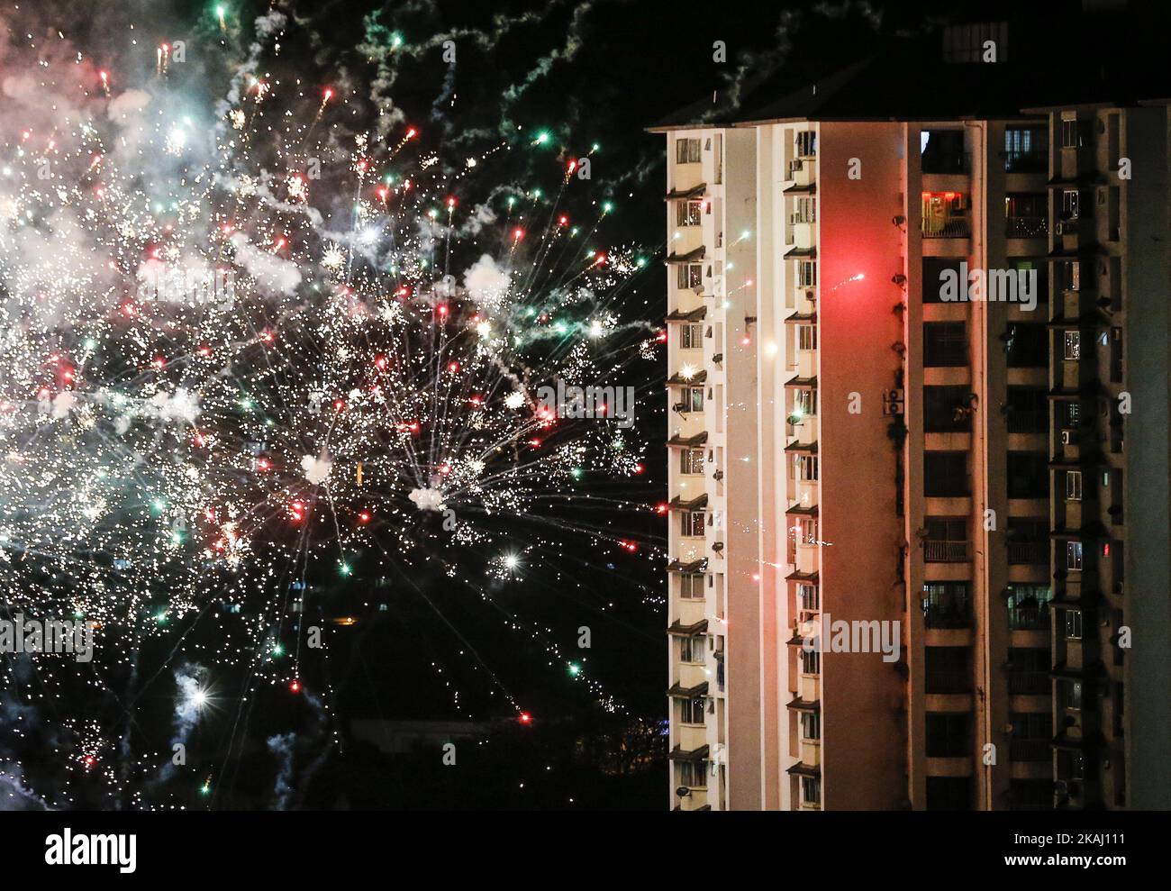 Fireworks explode near apartment building during celebrations of the ...
