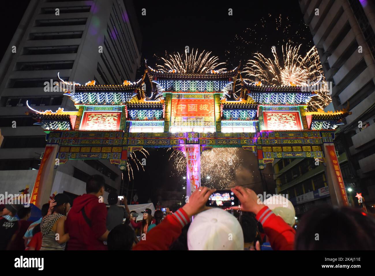 Fireworks illuminate the sky above the Chinatown friendship arch, the ...