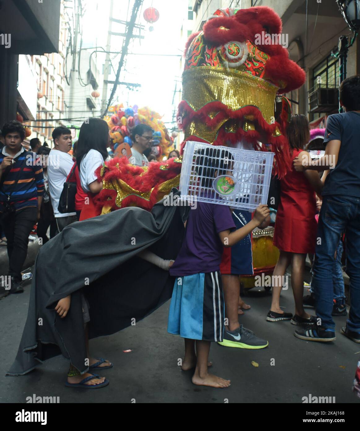 MANILA, Philippines - Children play with their makeshift lion dance ...