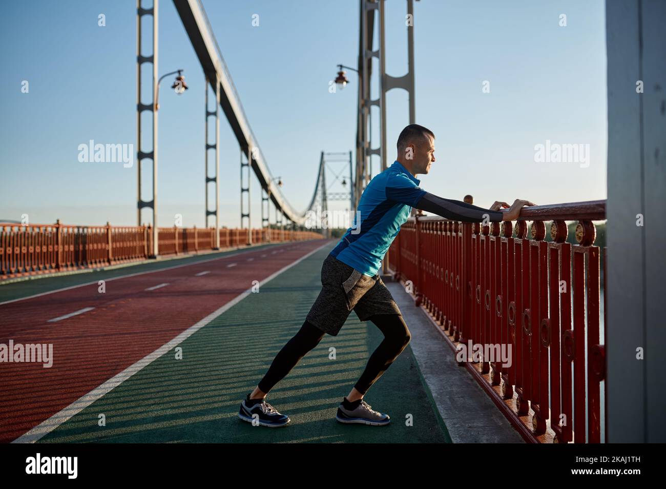 Man runner stretching hi-res stock photography and images - Alamy