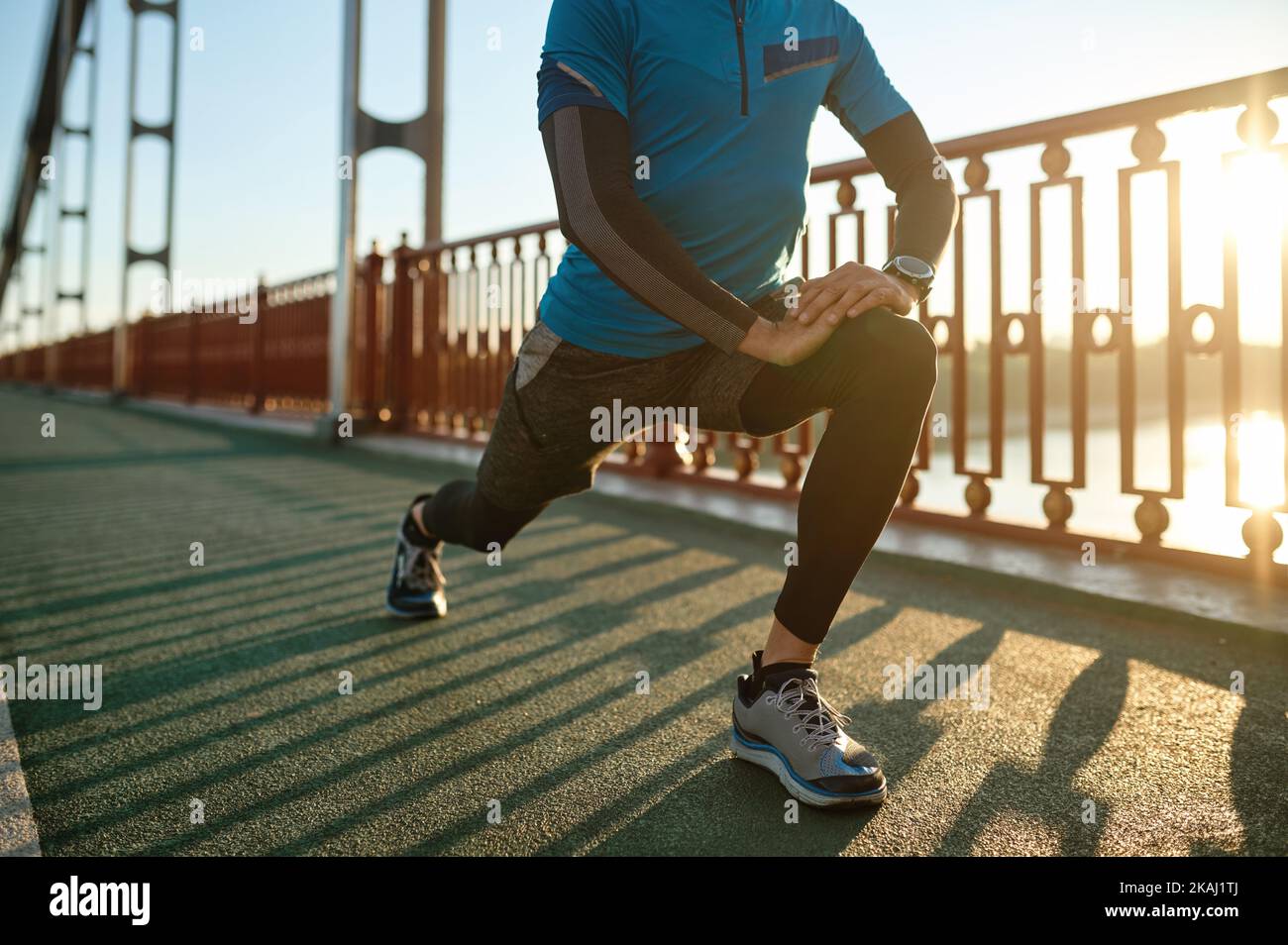 Man runner stretching hi-res stock photography and images - Alamy