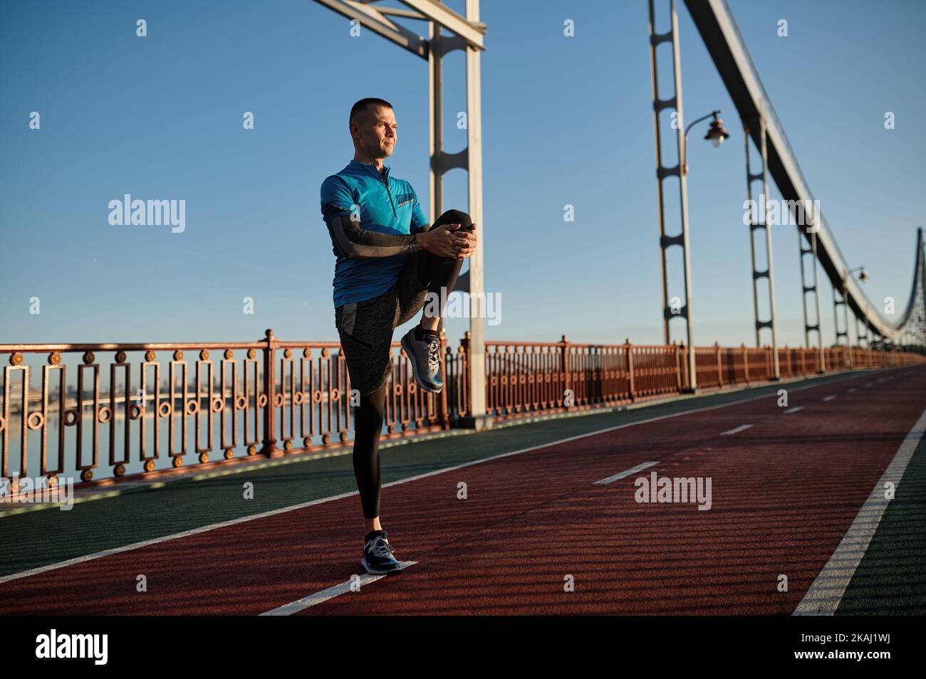 Man runner stretching hi-res stock photography and images - Alamy