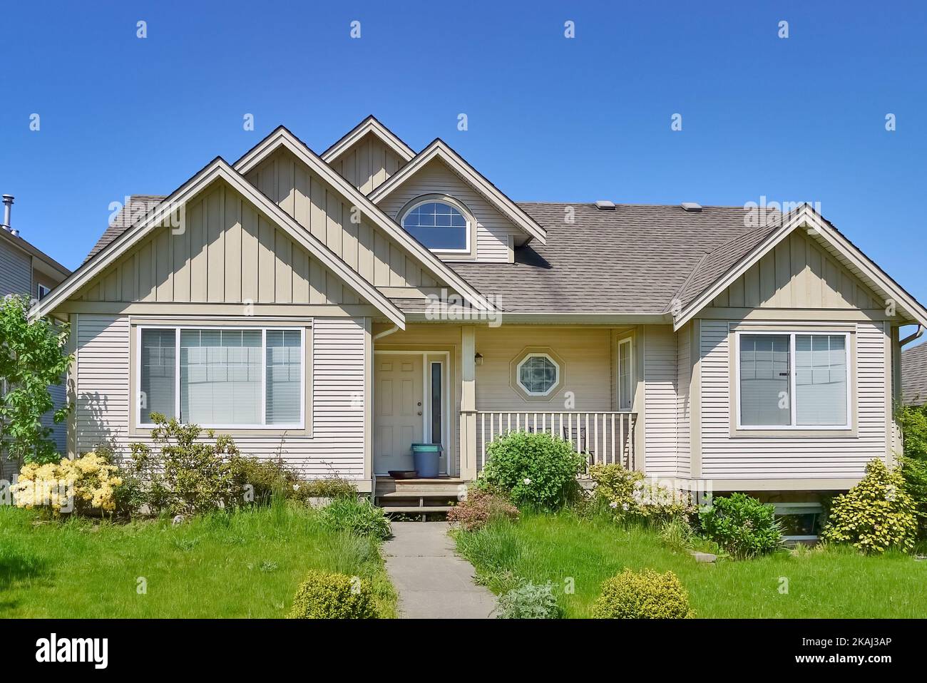 Average residential house in Canada on blue sky background Stock Photo ...