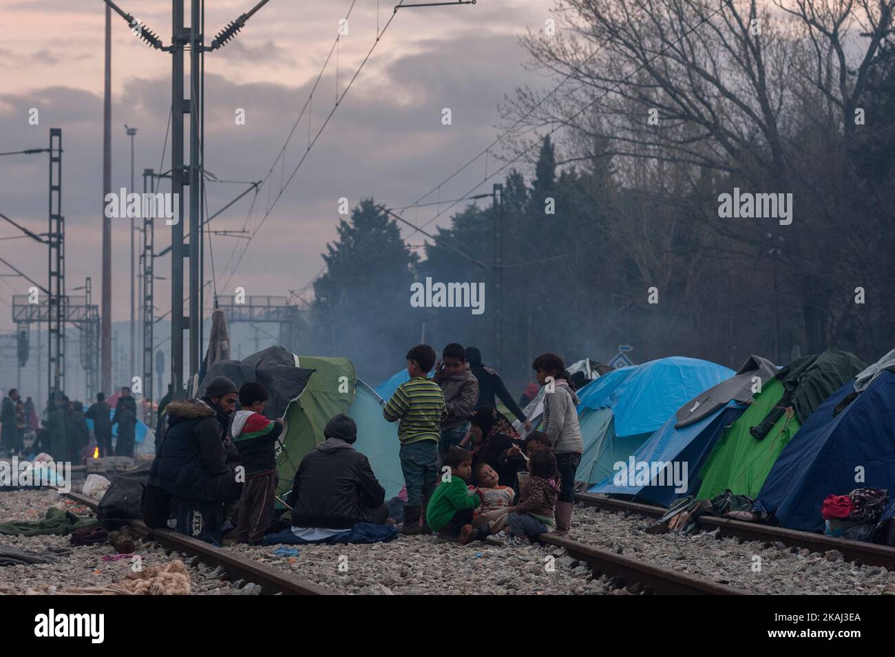 Smoke rises from bonfire on March 10, 2016, in a makeshift camp at the ...