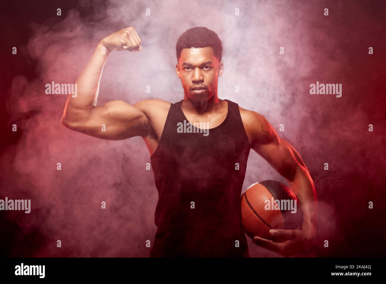 Young black man showing muscles hi-res stock photography and images - Alamy