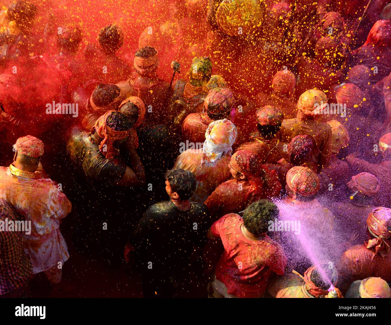 Indian hindu devotees throw coloured powder and sing traditional songs ...