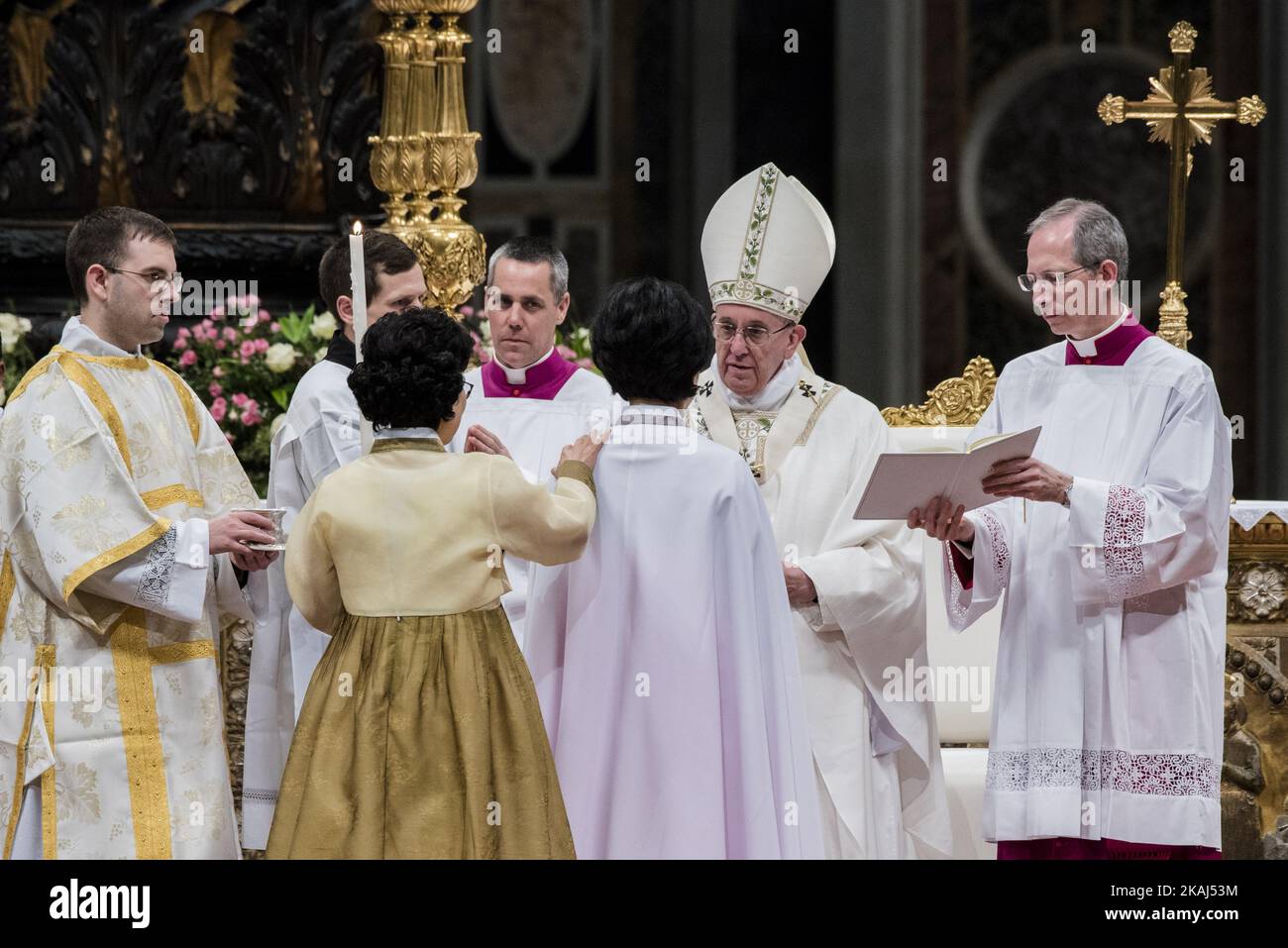 Pope Francis leads the Easter Vigil at the St Peter's basilica on March ...