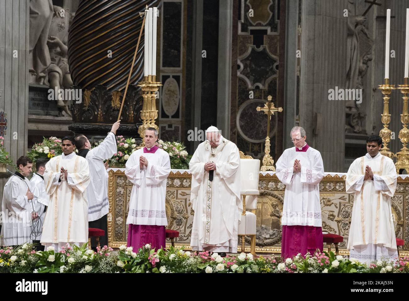 Pope Francis leads the Easter Vigil at the St Peter's basilica on March ...