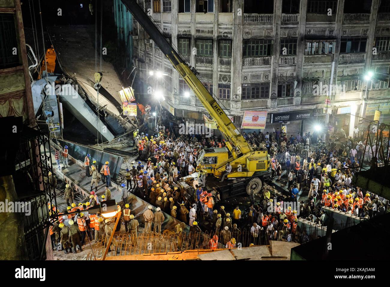 A crowd of people of military forces, rescue teams and curious ...