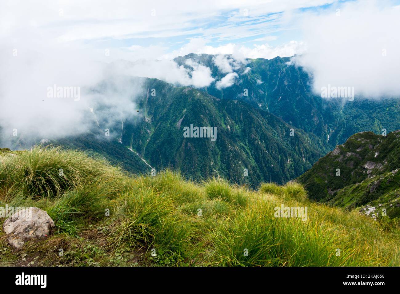 Beautiful mountains peaks and waterfalls in the background. Shrikhand ...