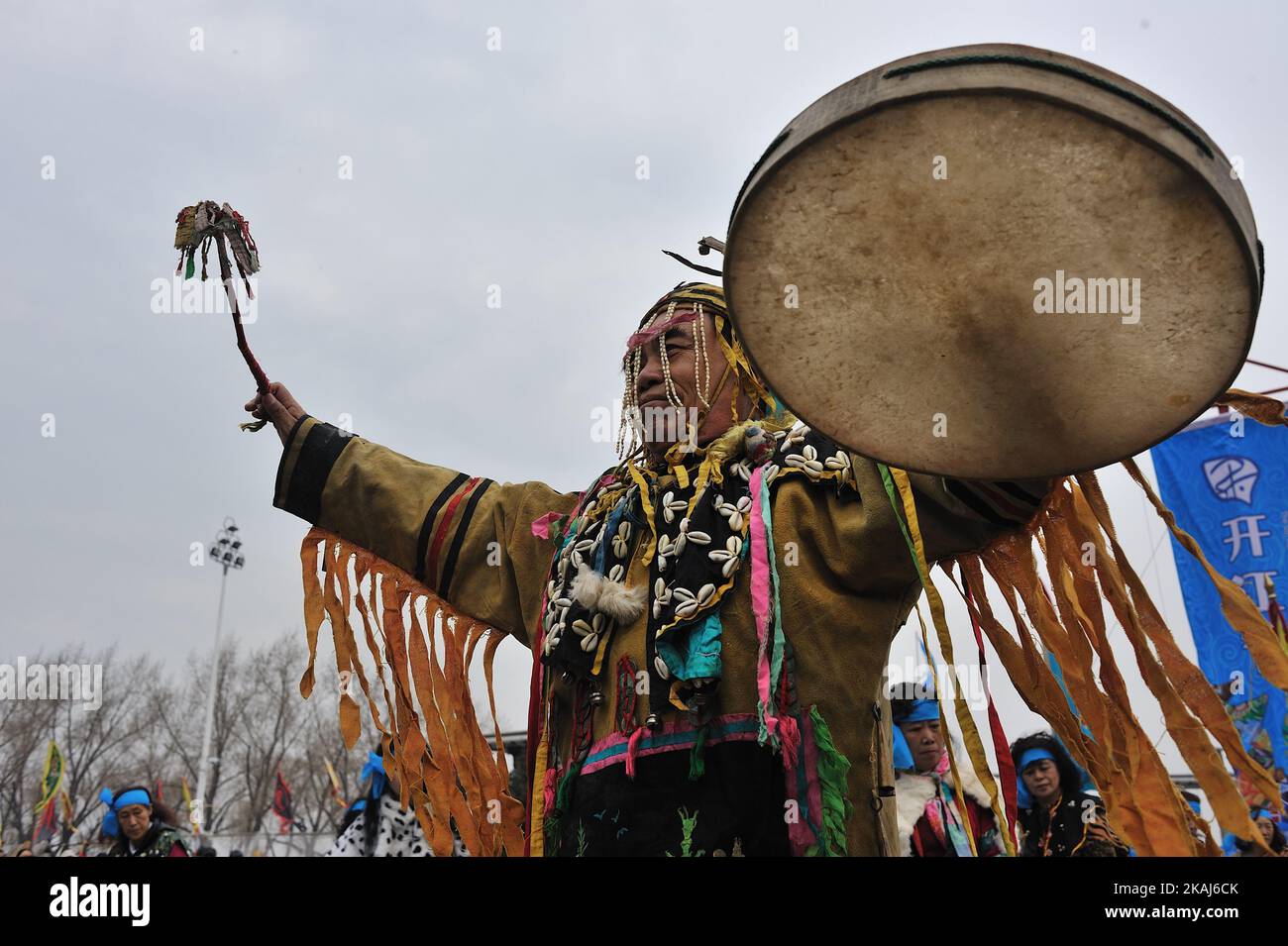 People perform Shaman Dance to pray at the opening of the Kaijiang ...
