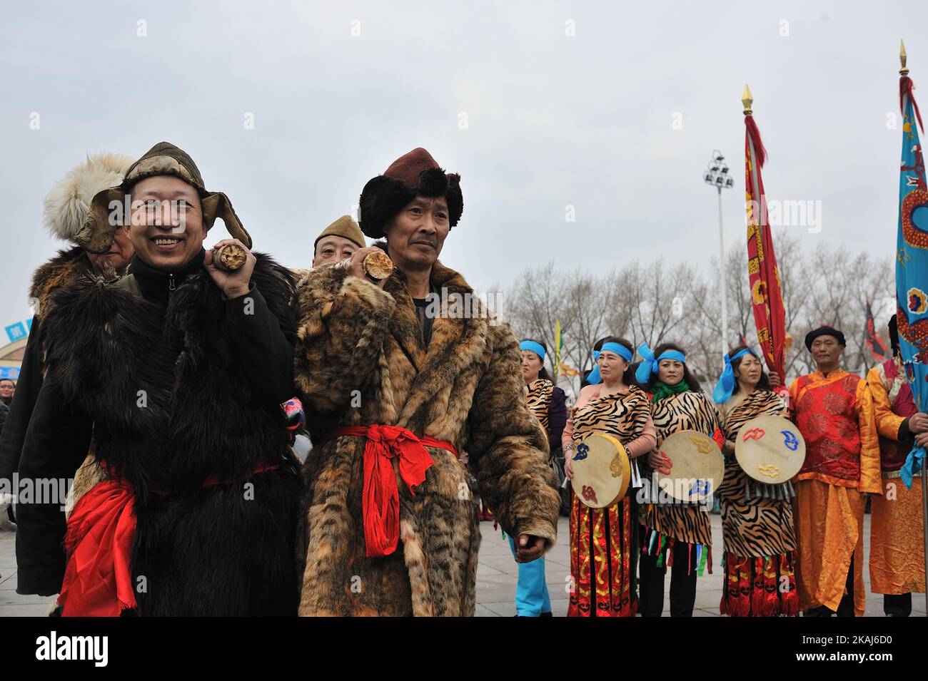 People perform Shaman Dance to pray at the opening of the Kaijiang ...