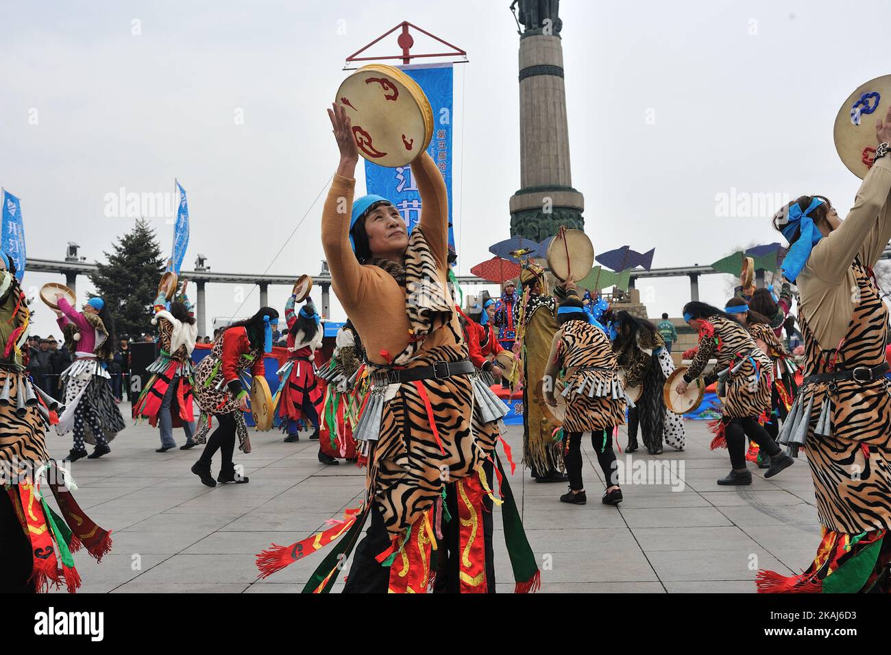 People perform Shaman Dance to pray at the opening of the Kaijiang ...
