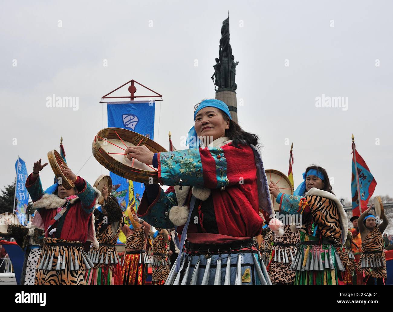 People perform Shaman Dance to pray at the opening of the Kaijiang ...