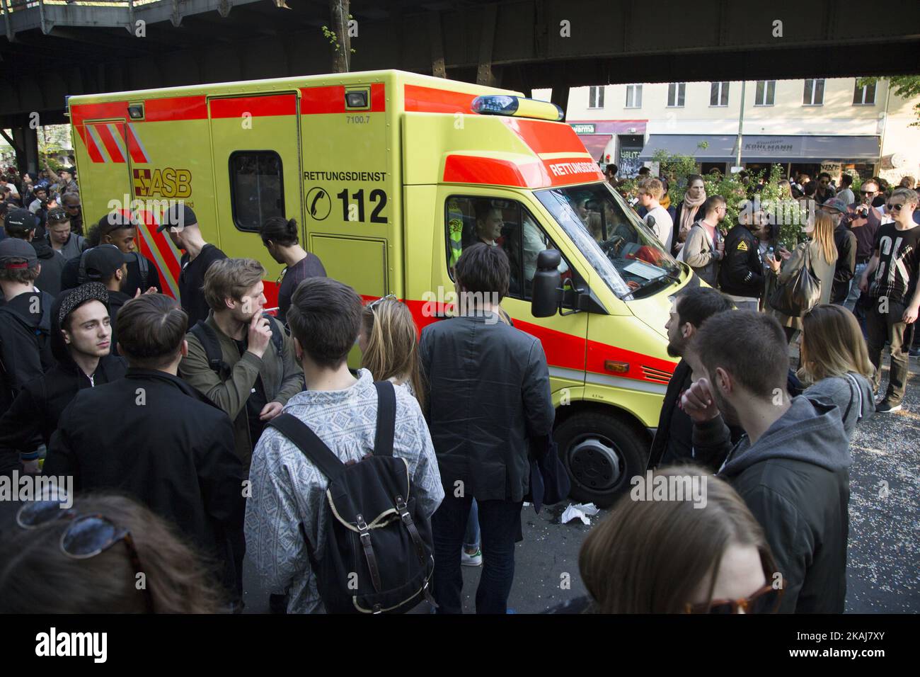 An ambulance proceeds through the crowd during the annual MyFest in the ...