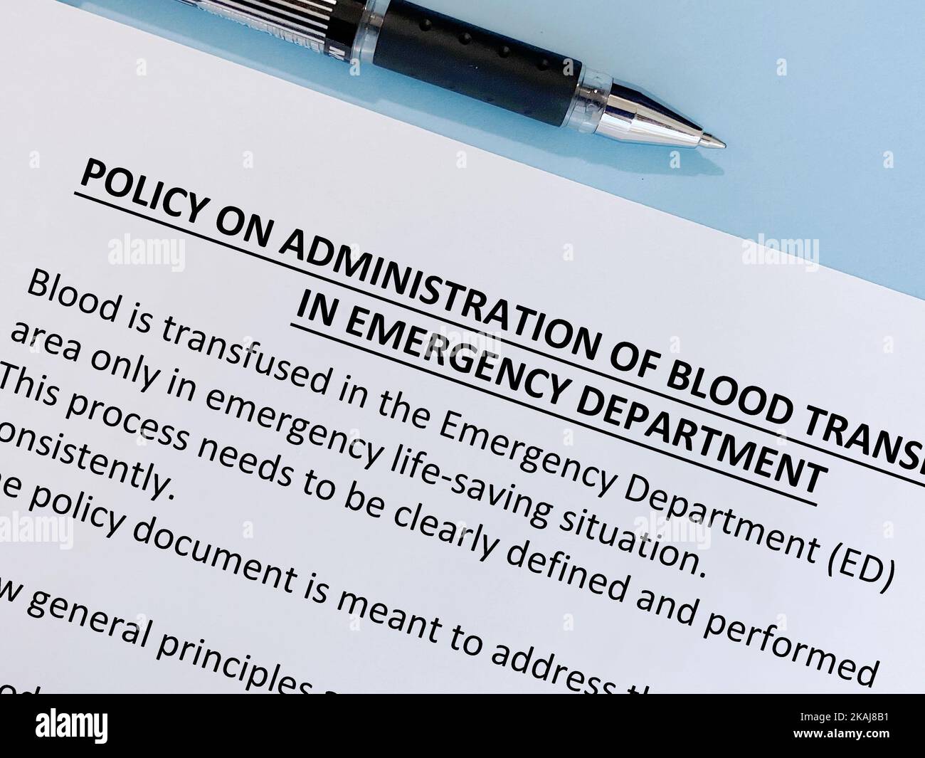 One person is reading policy on administration of blood transfusion in ...
