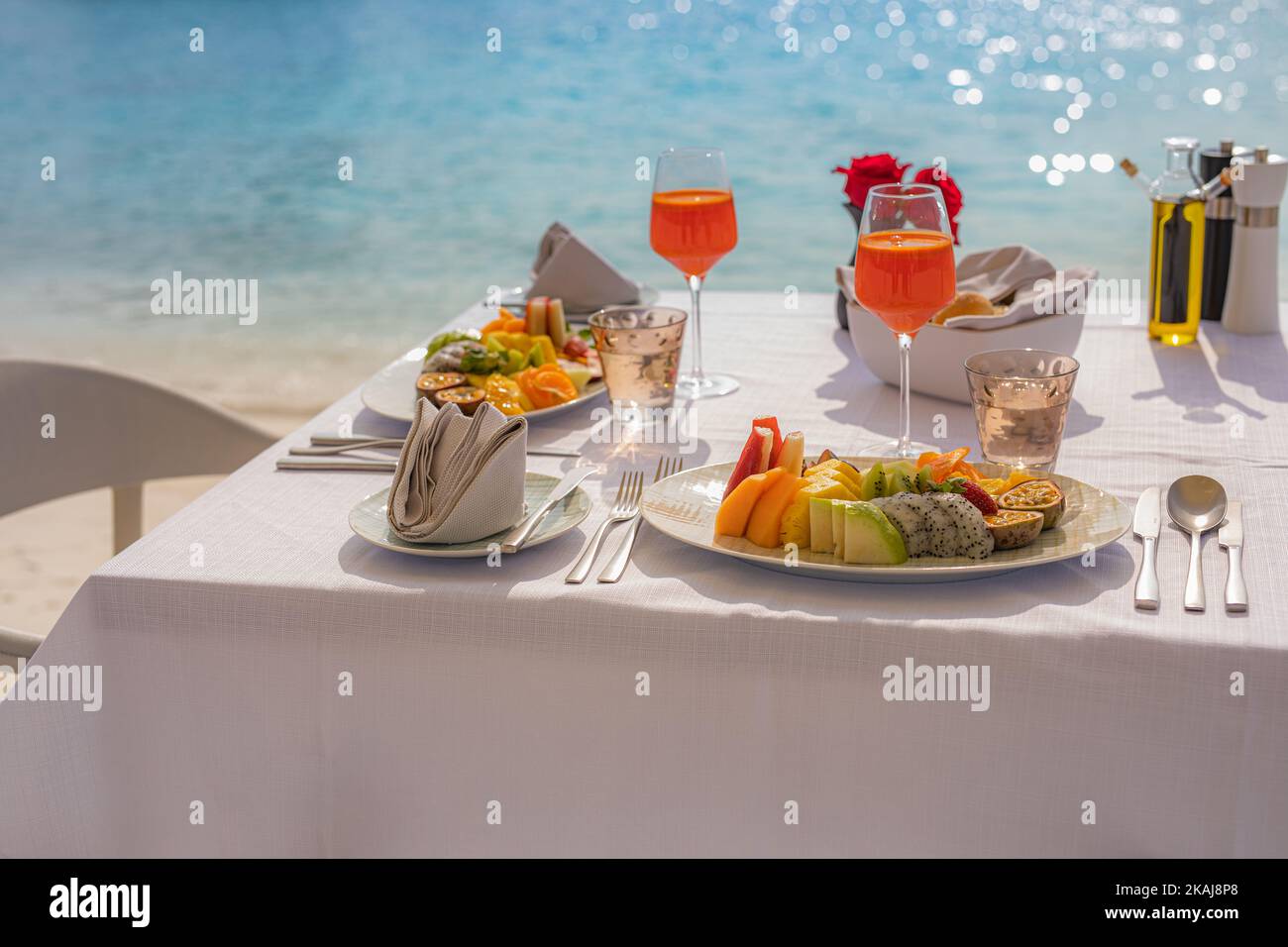 Luxury breakfast table with food for two with beautiful tropical sea ...