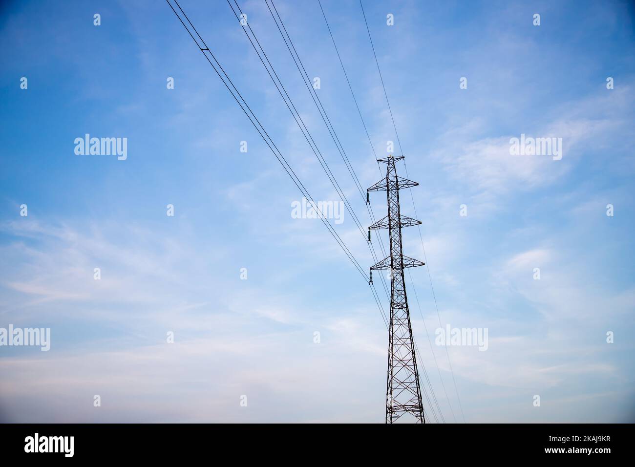 A transmission tower against the background of blue sky Stock Photo - Alamy