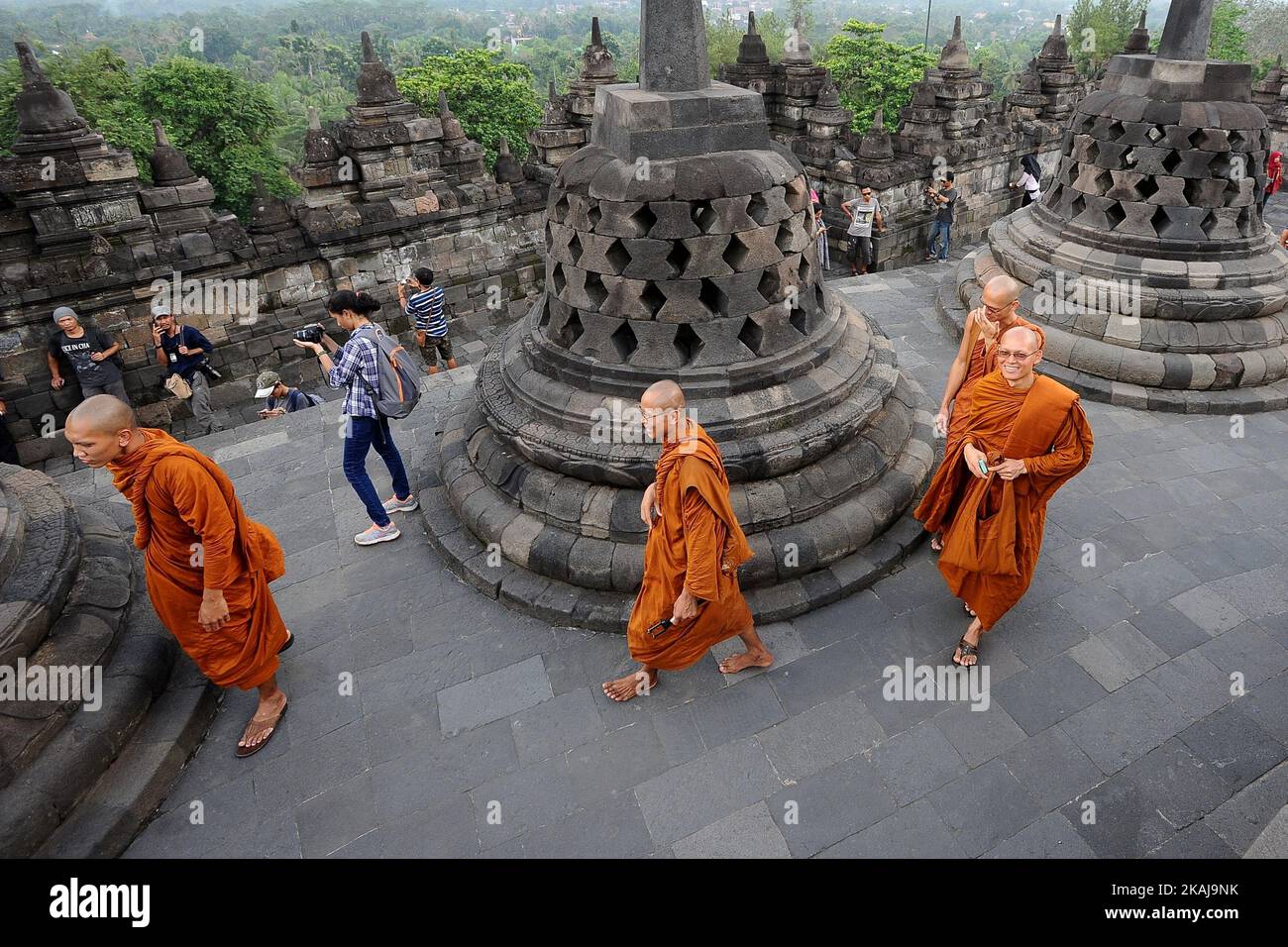 Buddhist monks walk around at Borobudur Temple on May 21, 2016 in ...