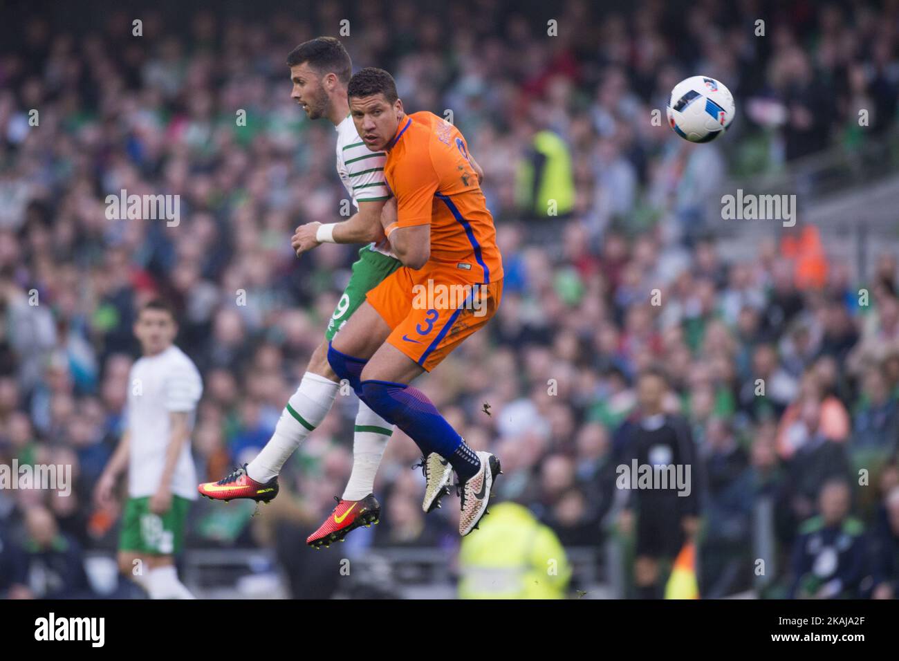 Jeffrey Bruma of Netherlands and Shane Long of Ireland jump for the ...