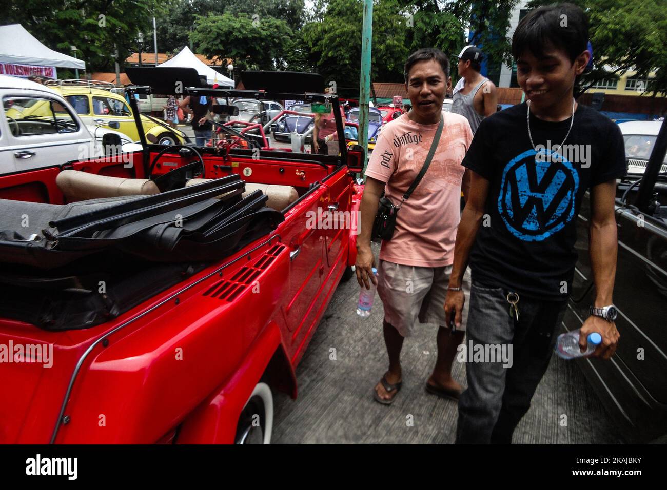 Car enthusiasts look at different Volkswagen models during the ...