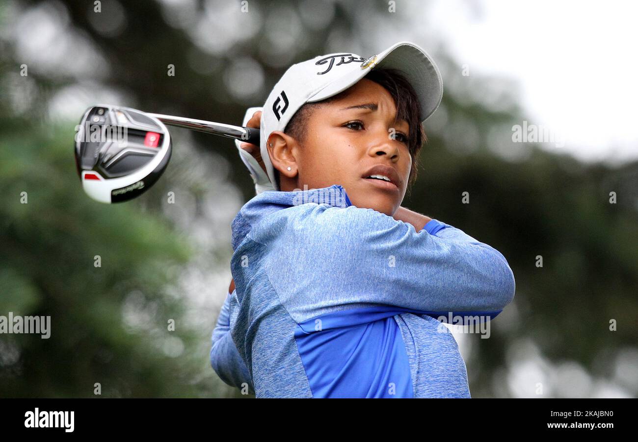 Ginger Howard of Bradenton, FL. follows her tee shot on the 17th hole ...