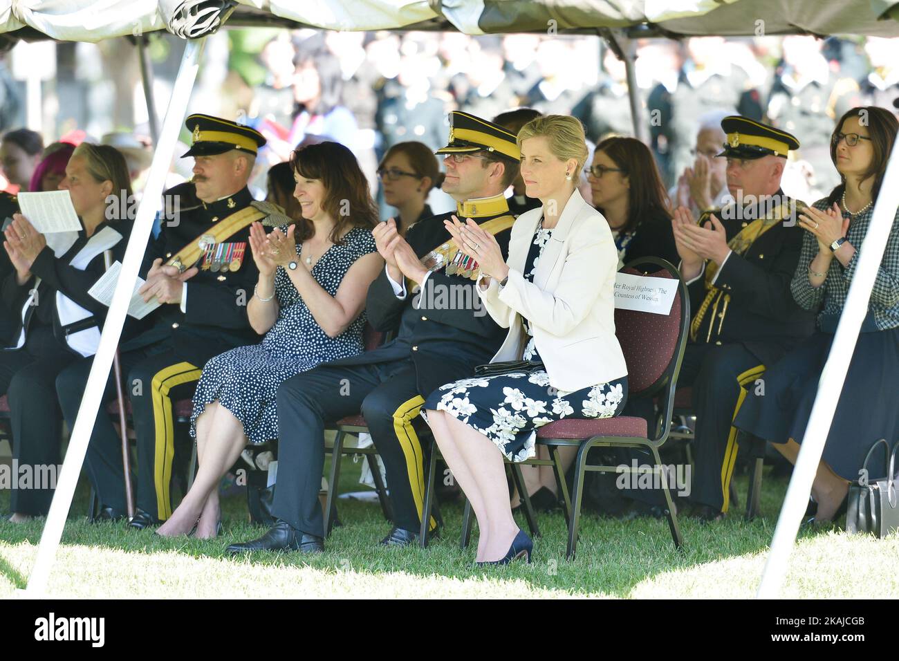 (In the center, left to right) Officer Charles Howie, Olivia Steele ...