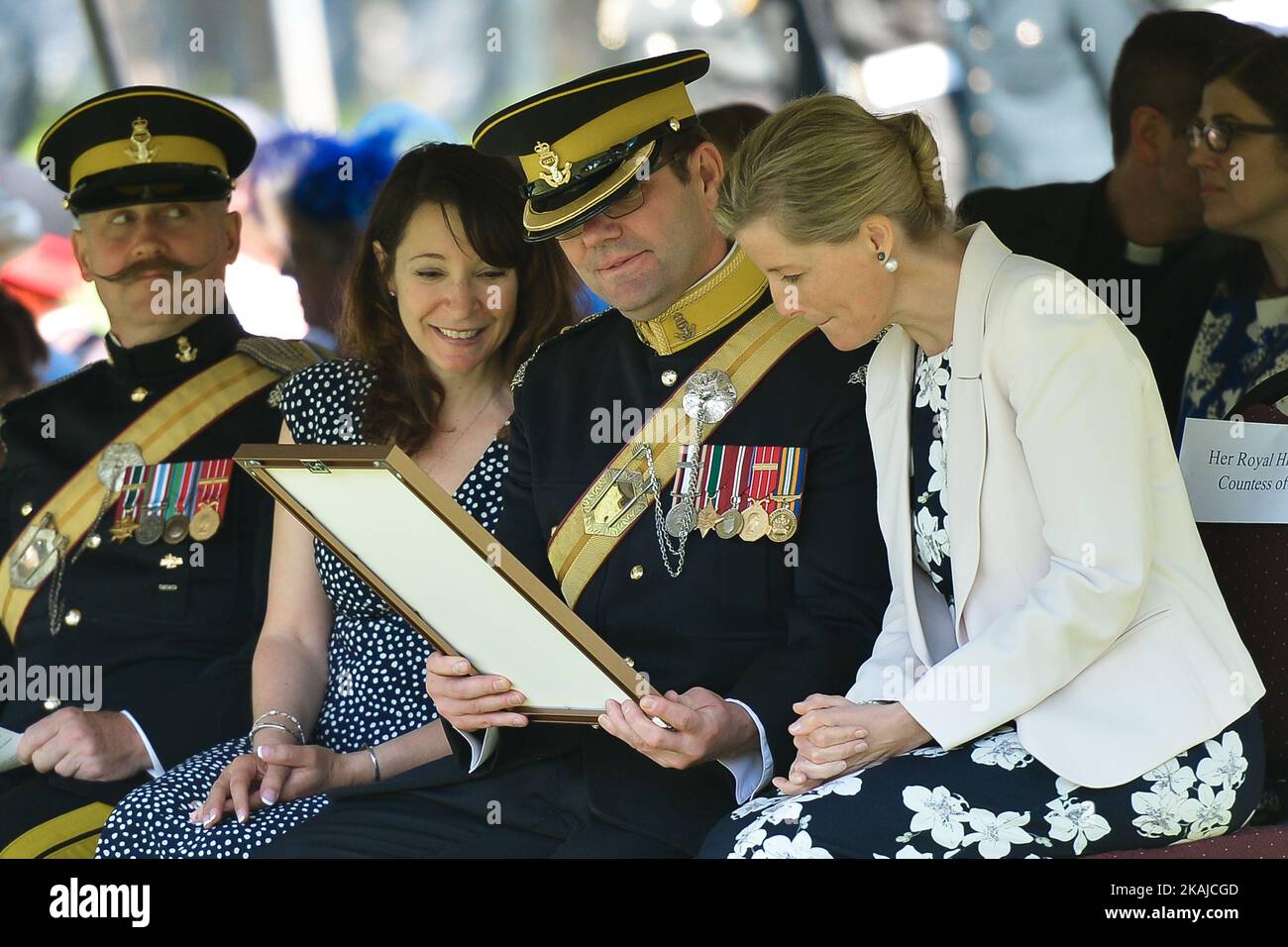 (In the center, left to right) Officer Charles Howie, Olivia Steele ...