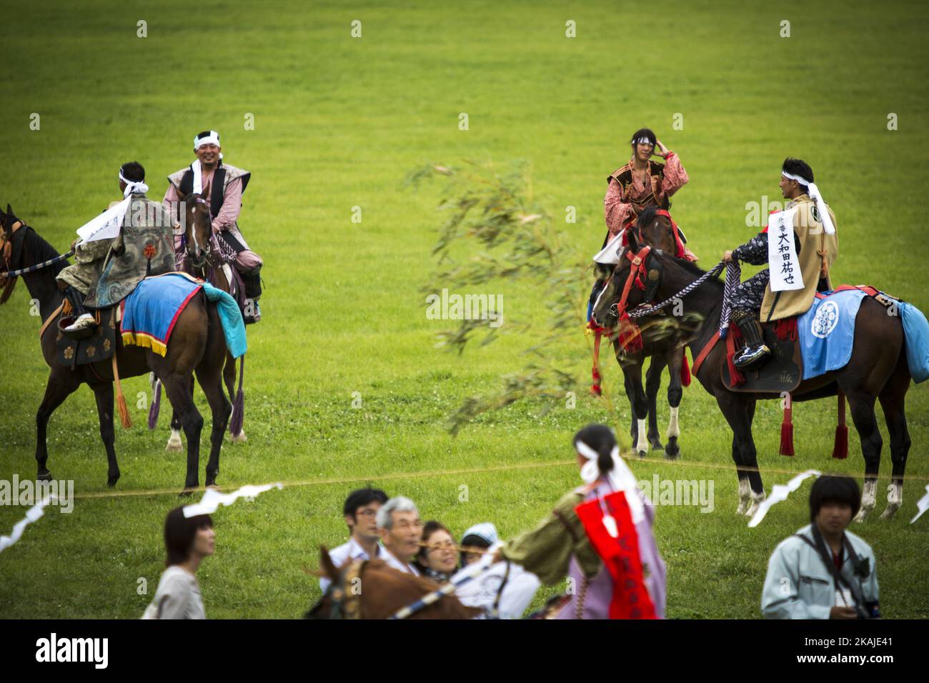 A samurai horsemen talk with each other after taking part in the ...
