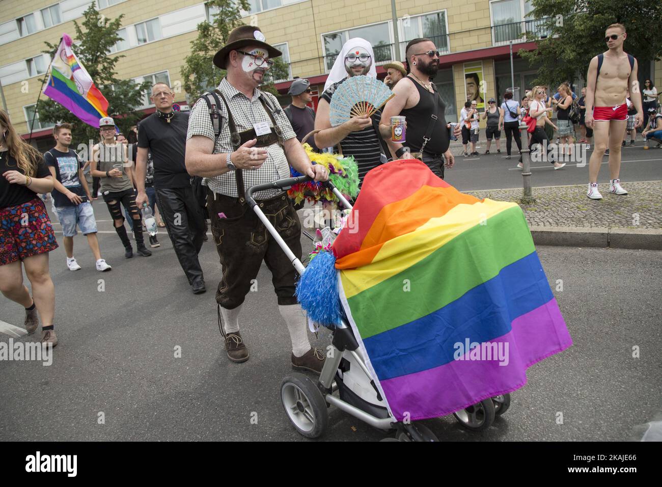 Revellers push a pushchair with a rainbow flag during the Christopher ...