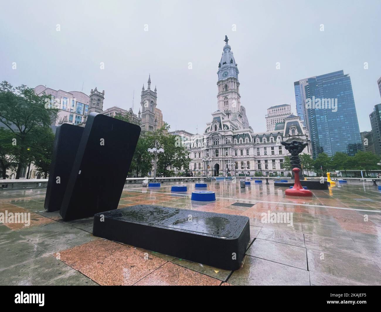 A rainy day in downtown Philadelphia with a park surrounded by ...
