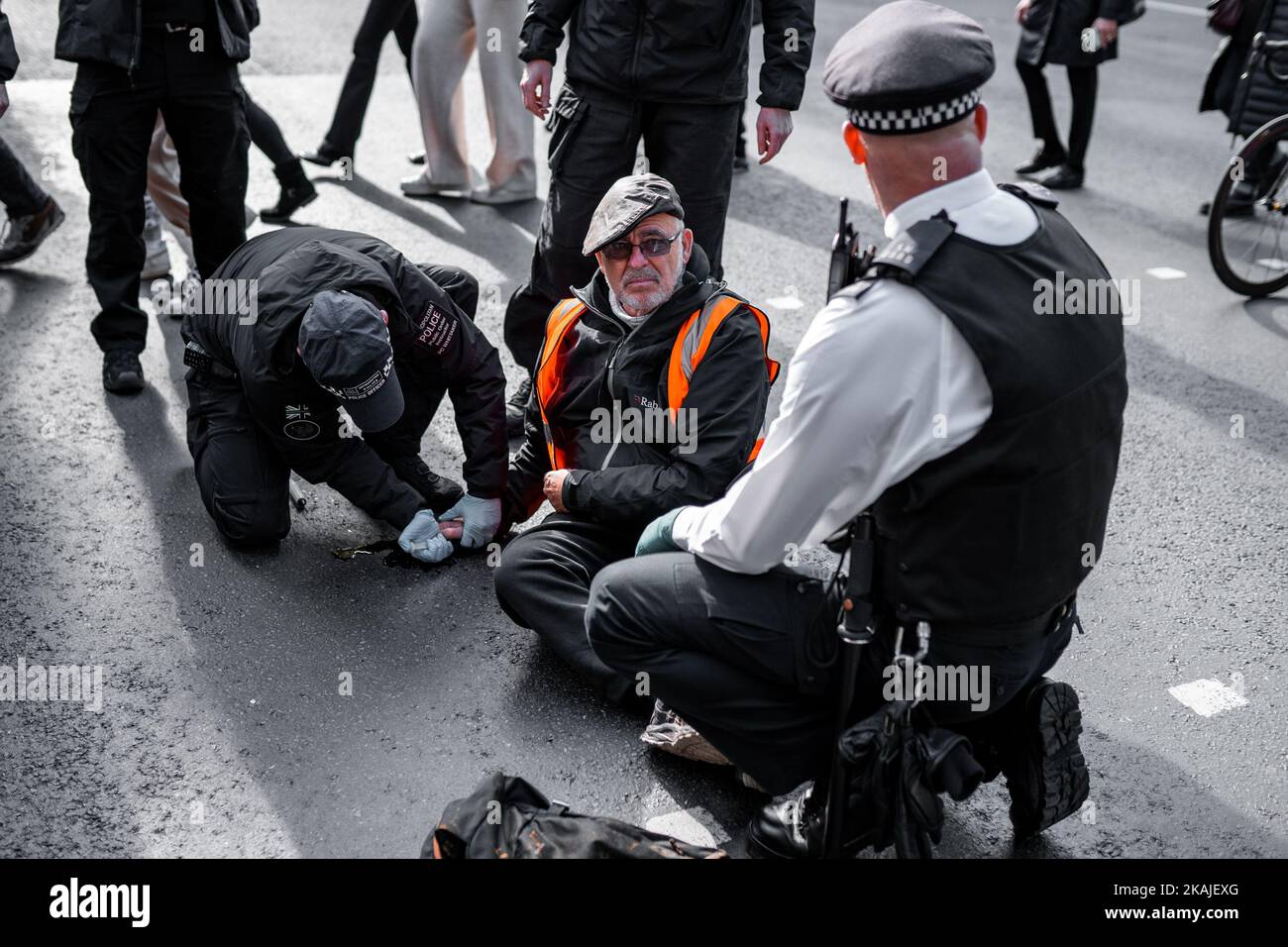 Just Stop Oil protesters glue themselves to Park Lane in Mayfair and ...