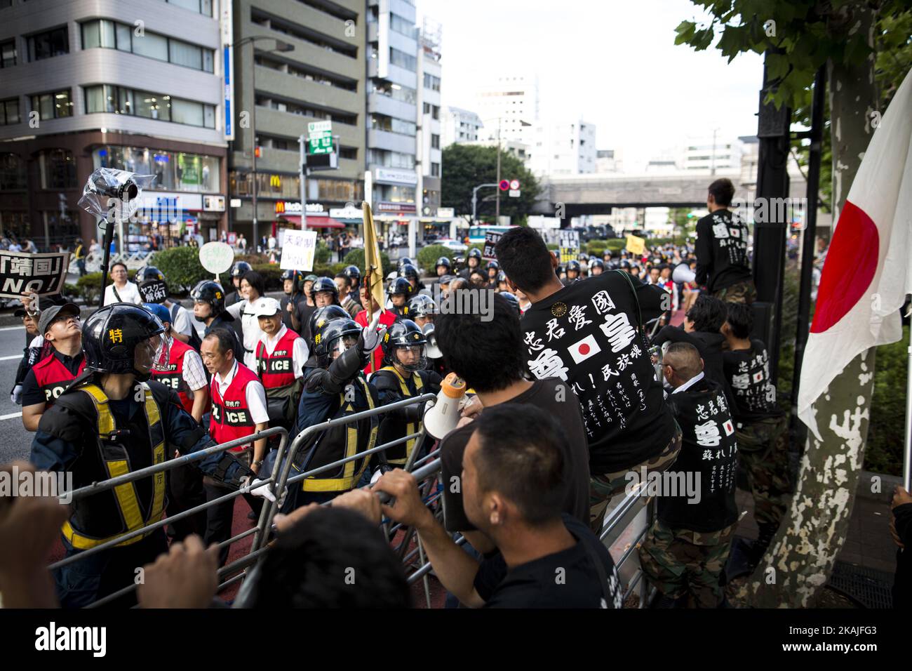 Japanese riot police guards the group of Anti-PM Shinzo Abe's members ...