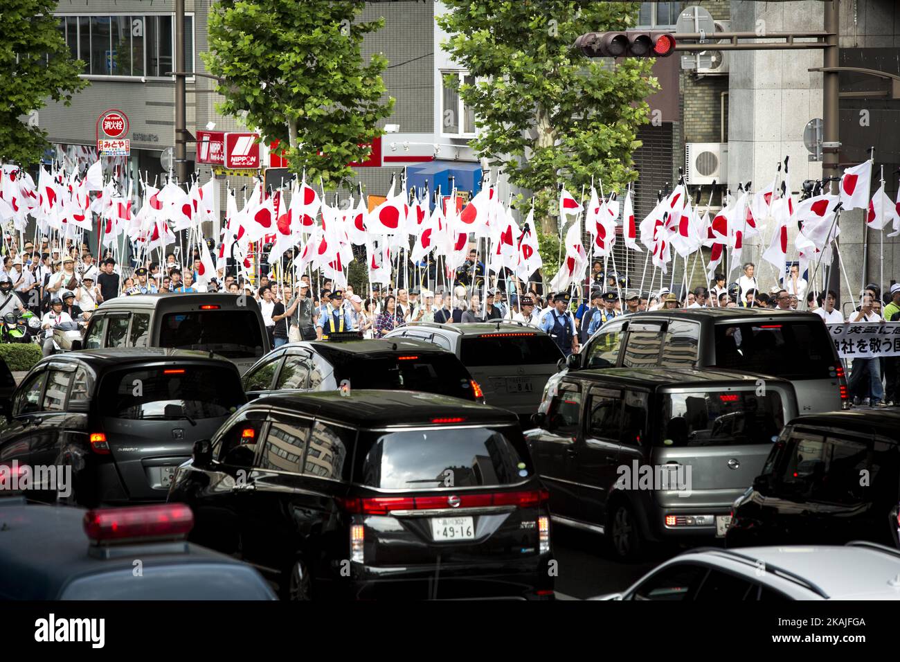 Members of nationalist group march with national flags during an anti ...